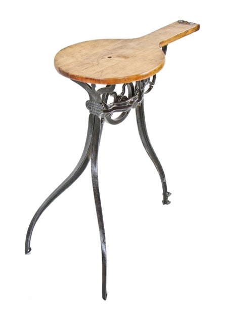 repurposed late 19th century three-legged cast iron foot-powered scrol ...